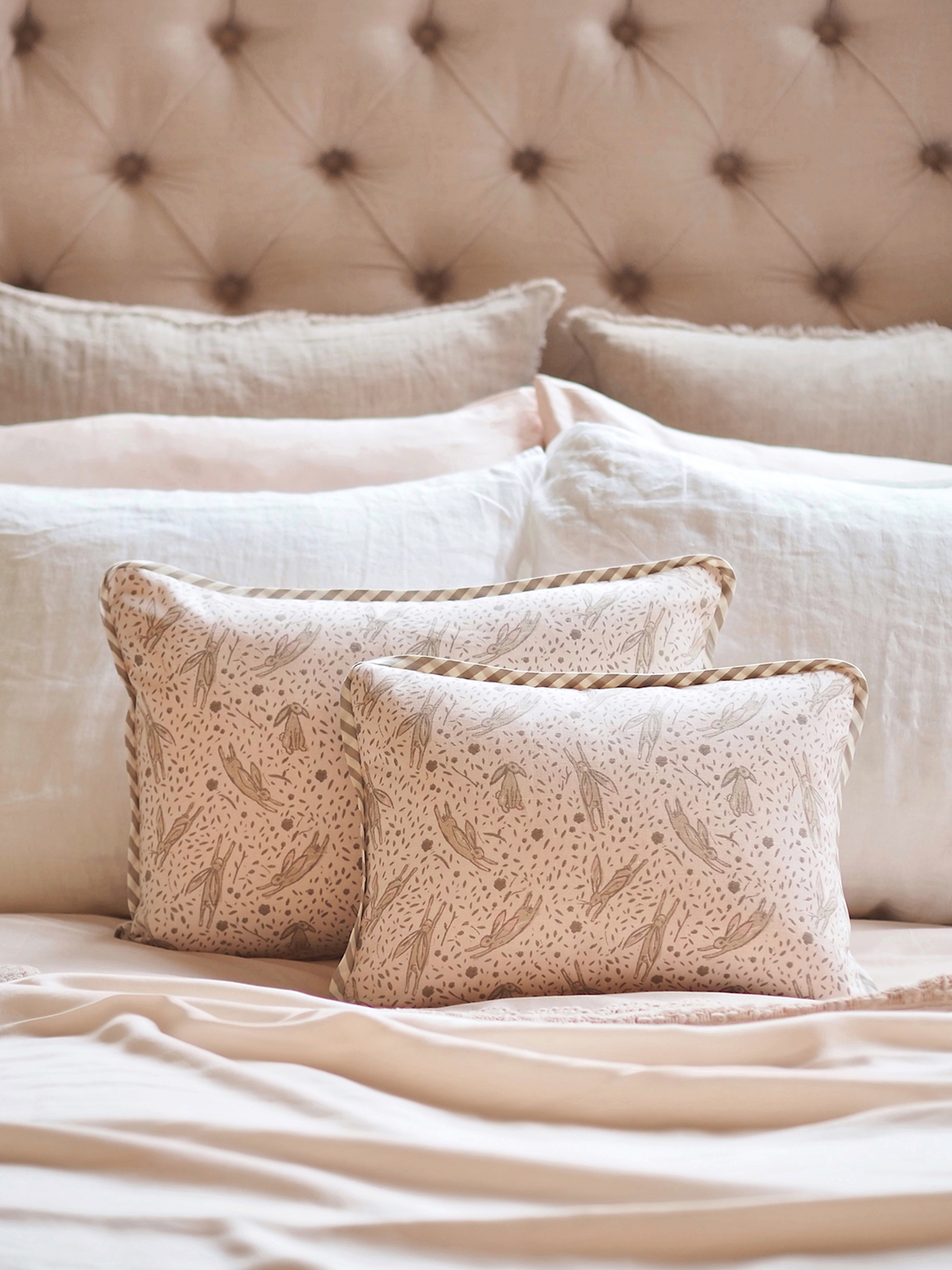 Leaping Rabbits Blush Pillow | The Cross Living